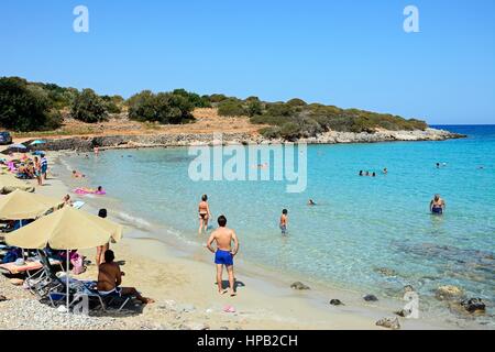 People swimming and relaxing on Istro, beach one of Crete's northern ...