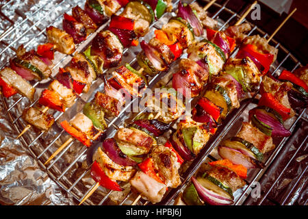 Spit Roast Beef Kebabs On The Hot Flaming BBQ Grill Close-up.Hand of ...