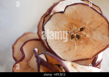 slices of dried apple on blue background. Shallow depth of field ...