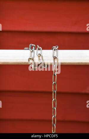 A steel chain wrapped around the metal gate Stock Photo - Alamy