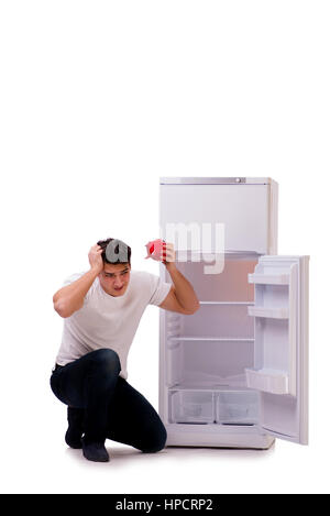 Hungry man looking for money to fill the fridge Stock Photo - Alamy