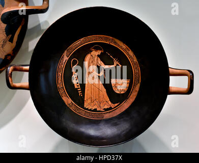 Flutist in front of a food basket depicted in the Attic red-figure ...