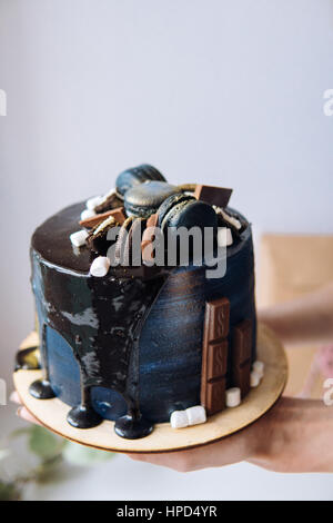 beautiful designer chocolate cake someone holds on hands Stock Photo ...