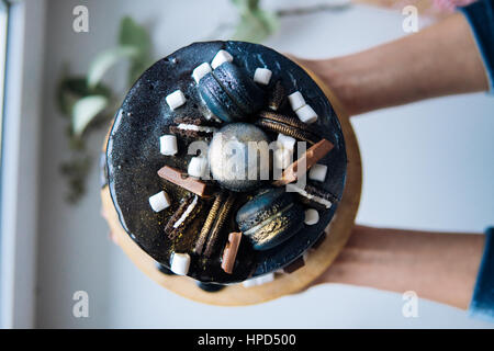beautiful designer chocolate cake someone holds on hands Stock Photo ...