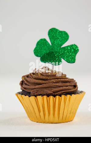 St. Patrick's Day tasty cupcake with green whipped cream decorated ...