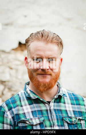 Portrait of red haired man with plaid shirt and long beard Stock Photo ...