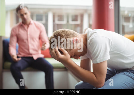 Teacher scolding a student Stock Photo - Alamy