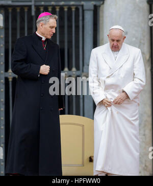 People leave St. Peter's Square after paying homage to the body of ...