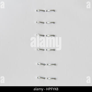 stapled paper isolated on white background Stock Photo - Alamy