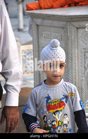 cute Indian boy with holy religious symbol on head at outdoor with ...