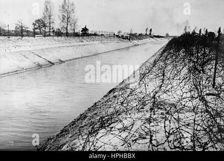 The Nazi propaganda image shows a line of German Wehrmacht concrete ...