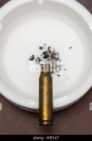bullet cartridge on ash tray Stock Photo - Alamy