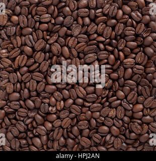 Coffee beans that spread out from a coffee cup Stock Photo - Alamy