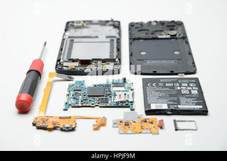 Disassembled smartphone with different electronic parts and lithium ion ...