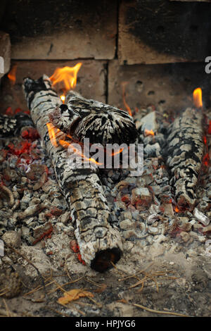 Burning heart, flames and fire. Burning heart. Brick wall, night, heart ...