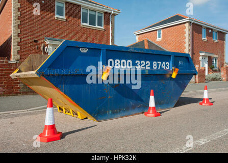 Rubbish skip being delivered on a residential road Stock Photo - Alamy