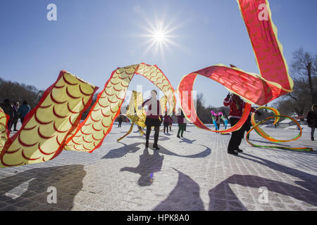Jilin, China. 23rd Feb, 2017. Women wave colourful ribbons to celebrate ...