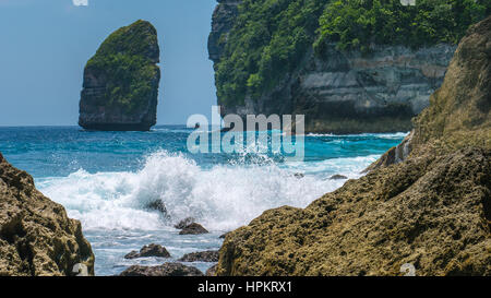 Rock in Tembeling Coastline at Nusa Penida island, Ocean Waves in Front ...