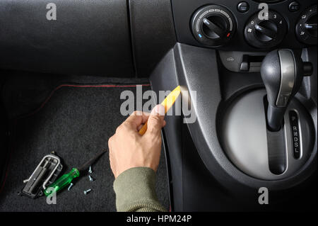 disassembly the center console of the car, transportation concept Stock ...