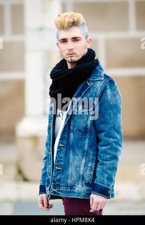 Young caucasian man wearing casual white t-shirt over yellow isolated ...