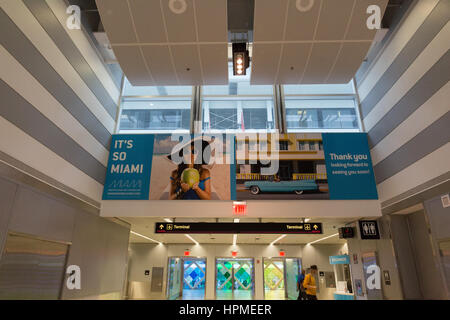 Concourse signs at Miami airport Stock Photo - Alamy