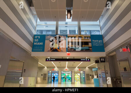 Concourse signs at Miami airport Stock Photo - Alamy