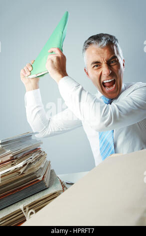 Overworked mature business man screaming in anger Stock Photo - Alamy
