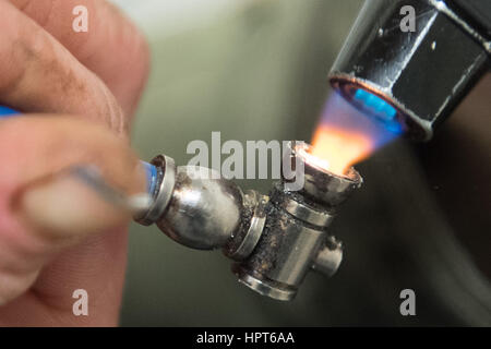 A drug addict lights crack using a gas burner in Frankfurt/Main ...