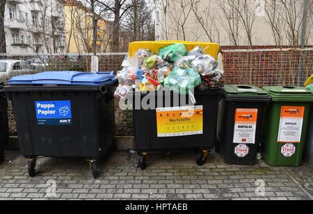Germany Berlin overflowing rubbish bin and littered lawn in the ...