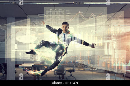 Young cheeful businessman dancing in his office. Mixed media Stock ...