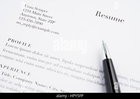 Resume with pen, close-up Stock Photo - Alamy