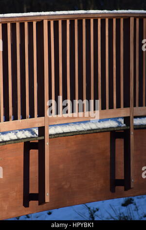 Wooden bridge with snow on sunny day Stock Photo - Alamy