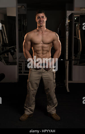 Bodybuilder Posing In Different Poses Demonstrating Their Muscles ...