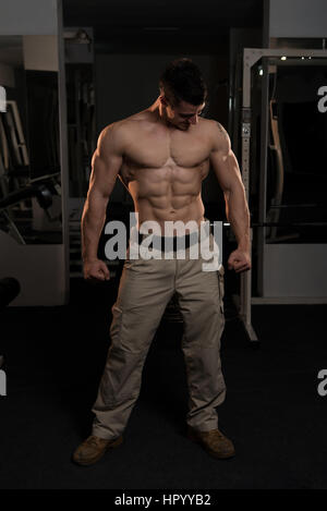 Bodybuilder Posing In Different Poses Demonstrating Their Muscles ...