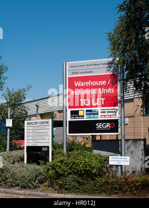 Estate agents industrial warehouse units to let sign Stock Photo - Alamy