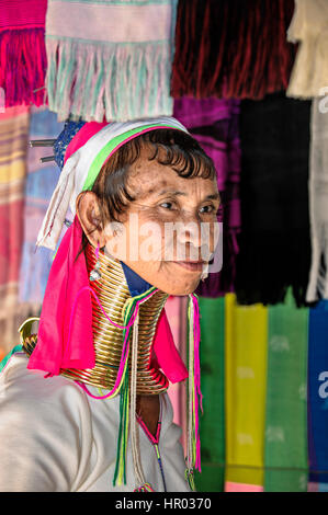An elderly Karen long-neck tribe woman is seen sitting at her ...