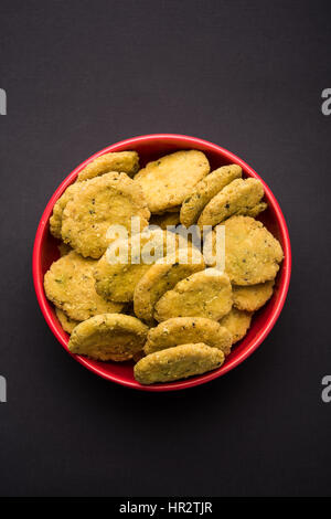 spicy fried mathri or mathari which is an indian snack served with a ...