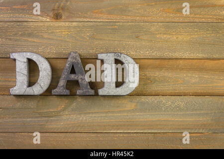 Metal letters DAD on a painted wood background Stock Photo - Alamy
