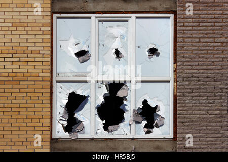Vandals smashed the glass of windows of the an unfinished shopping mall ...