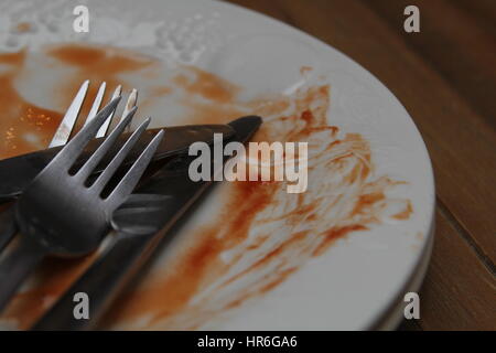 Dirty dinner plates and cutlery ready to be washed up Stock Photo - Alamy