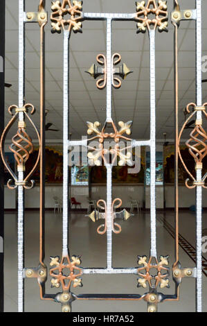 entry to Hindu Temple, iron gate decorated with swastika symbols ...