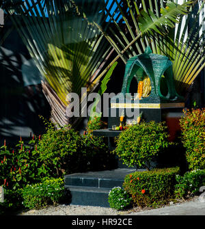 Outdoor spirit house in Thailand. garland and some wreathes, joss house ...