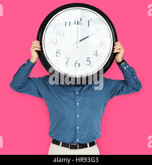 Man Holding Clock Covering Face Stock Photo - Alamy