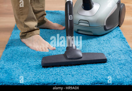 Closeup of feet and vacuum Stock Photo - Alamy