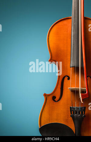 Violin front view on blue studio background Stock Photo - Alamy