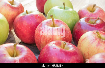 Group of red apples on wooden surface Stock Photo - Alamy
