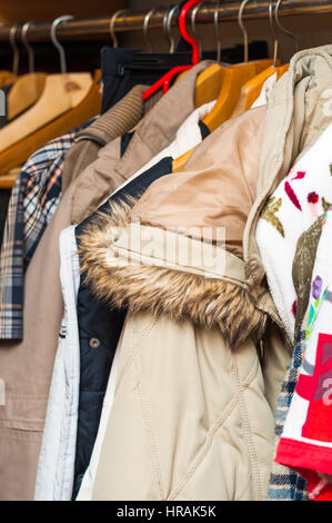 Colorful clothes hanging in wardrobe Stock Photo - Alamy