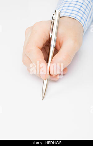 Macro shot of a hand of a businessman signing or writing a document on ...