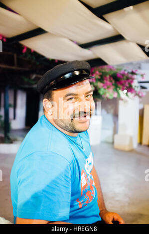 Local Greek man smiling in the sun, Rhodes Island, Kallithea, Greece ...