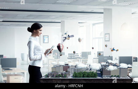Elegant engineer woman . Mixed media Stock Photo - Alamy